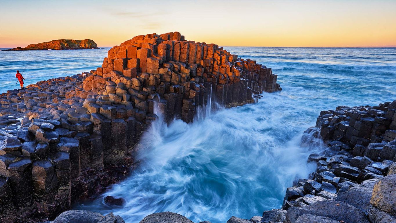 Fingal Head with a rock fisherman on the headland | Peapix