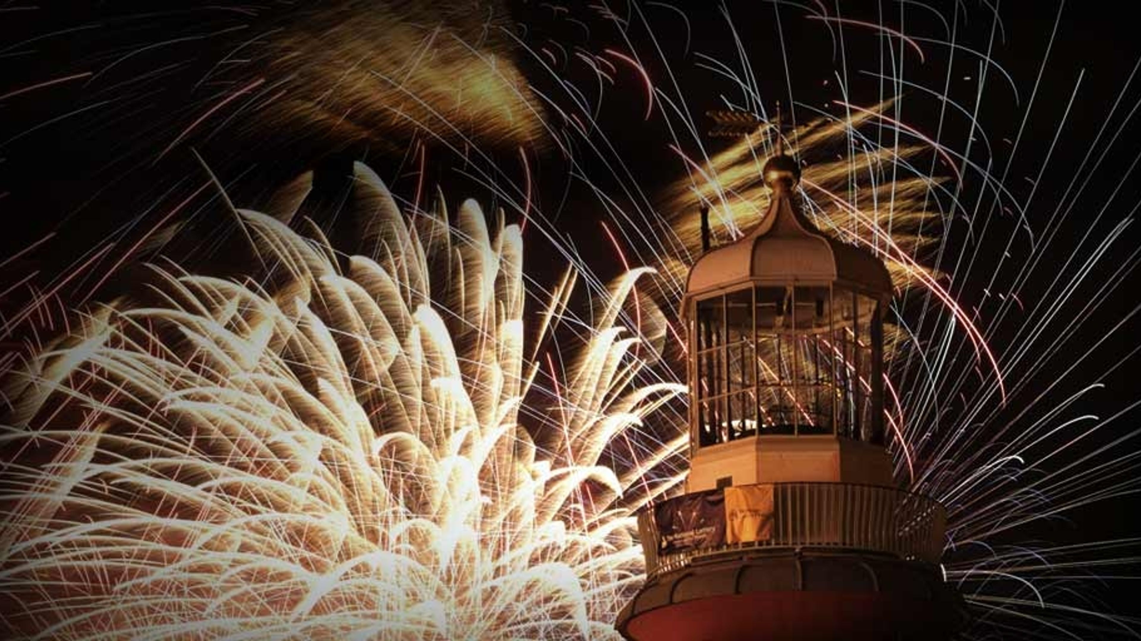Fireworks exploding behind Smeatons Tower lighthouse on Plymouth Hoe ...