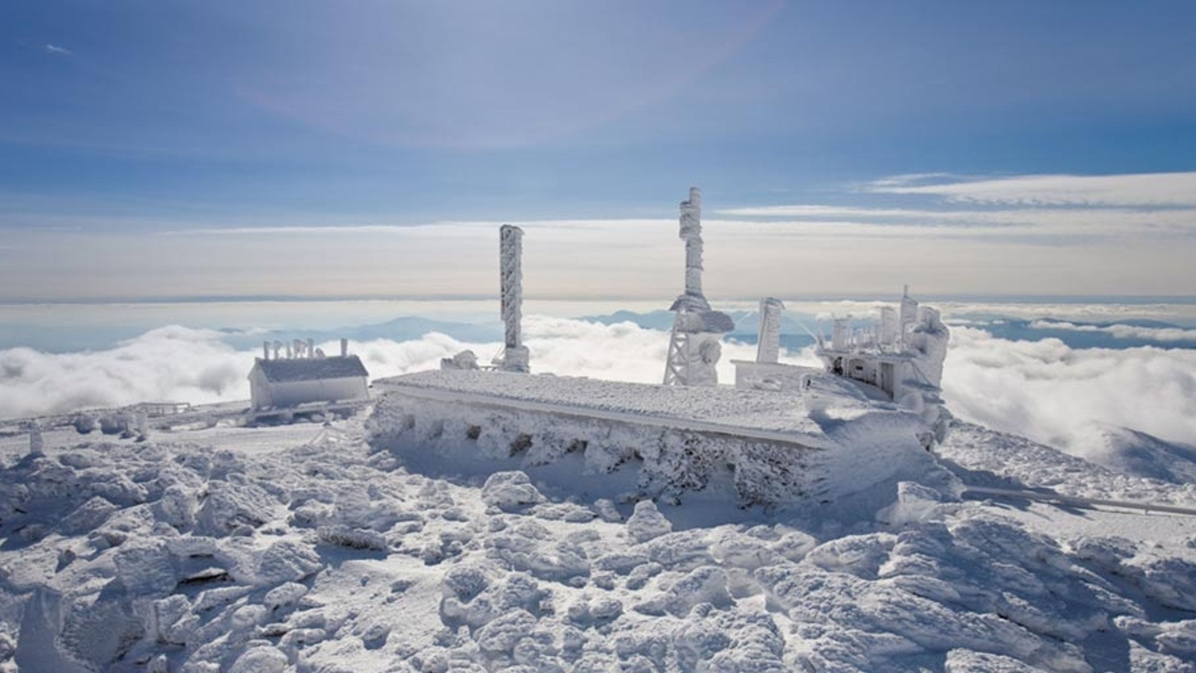 The Mount Washington Observatory, completely covered in hard rime ice ...