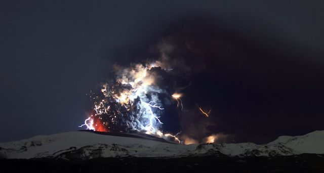 Volcanic eruptions are lit by lightning on the Eyjafjallajokull glacier ...