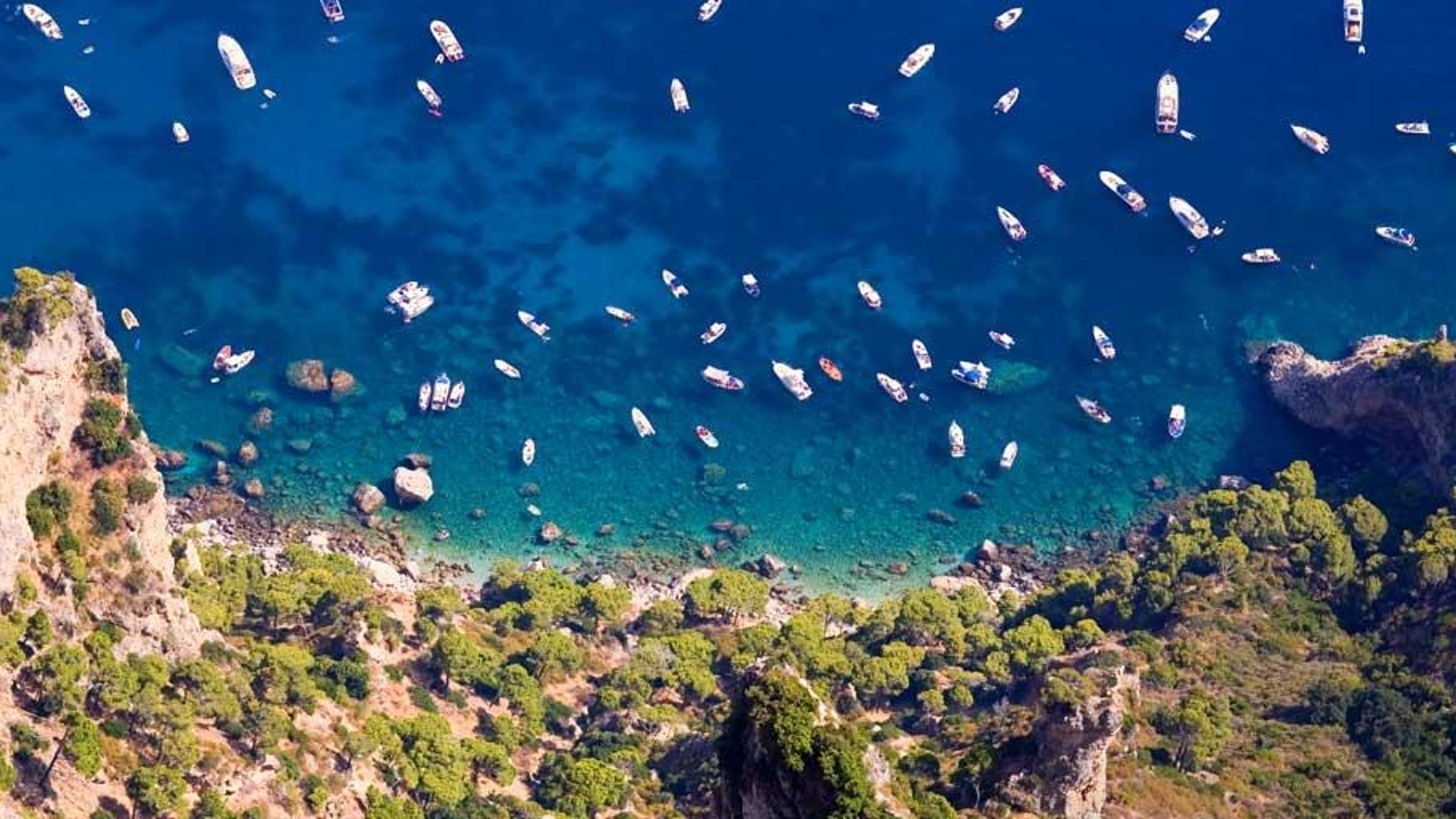 Aerial view of boats in the Tyrrhenian Sea, off the coast of Capri ...