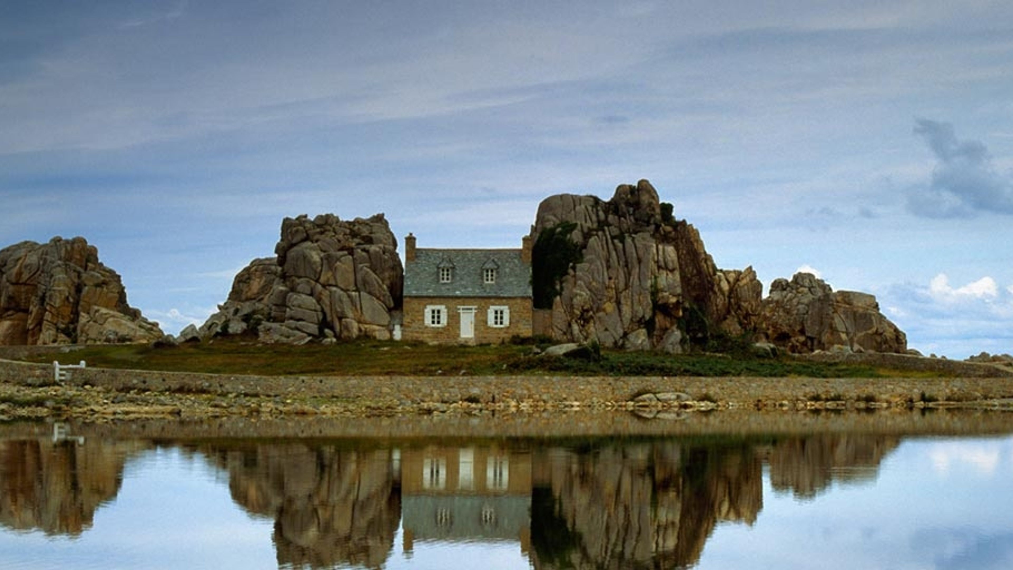 House between rocks is reflected in Brittany, France - Bing Gallery