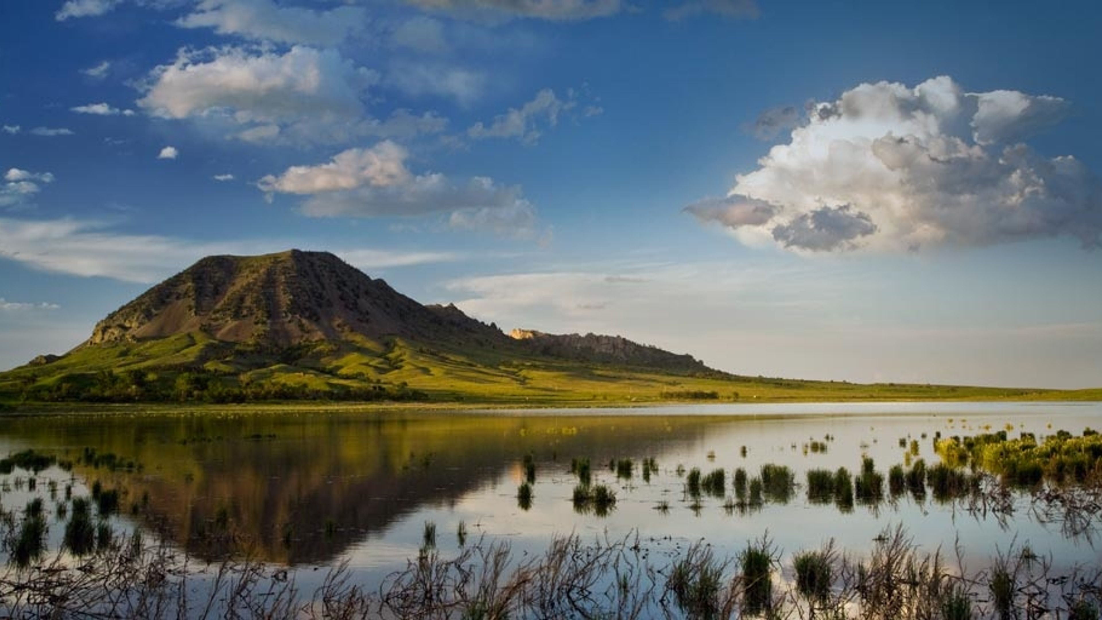 Bear Butte reflects into Bear Butte Lake near Sturgis, South Dakota ...