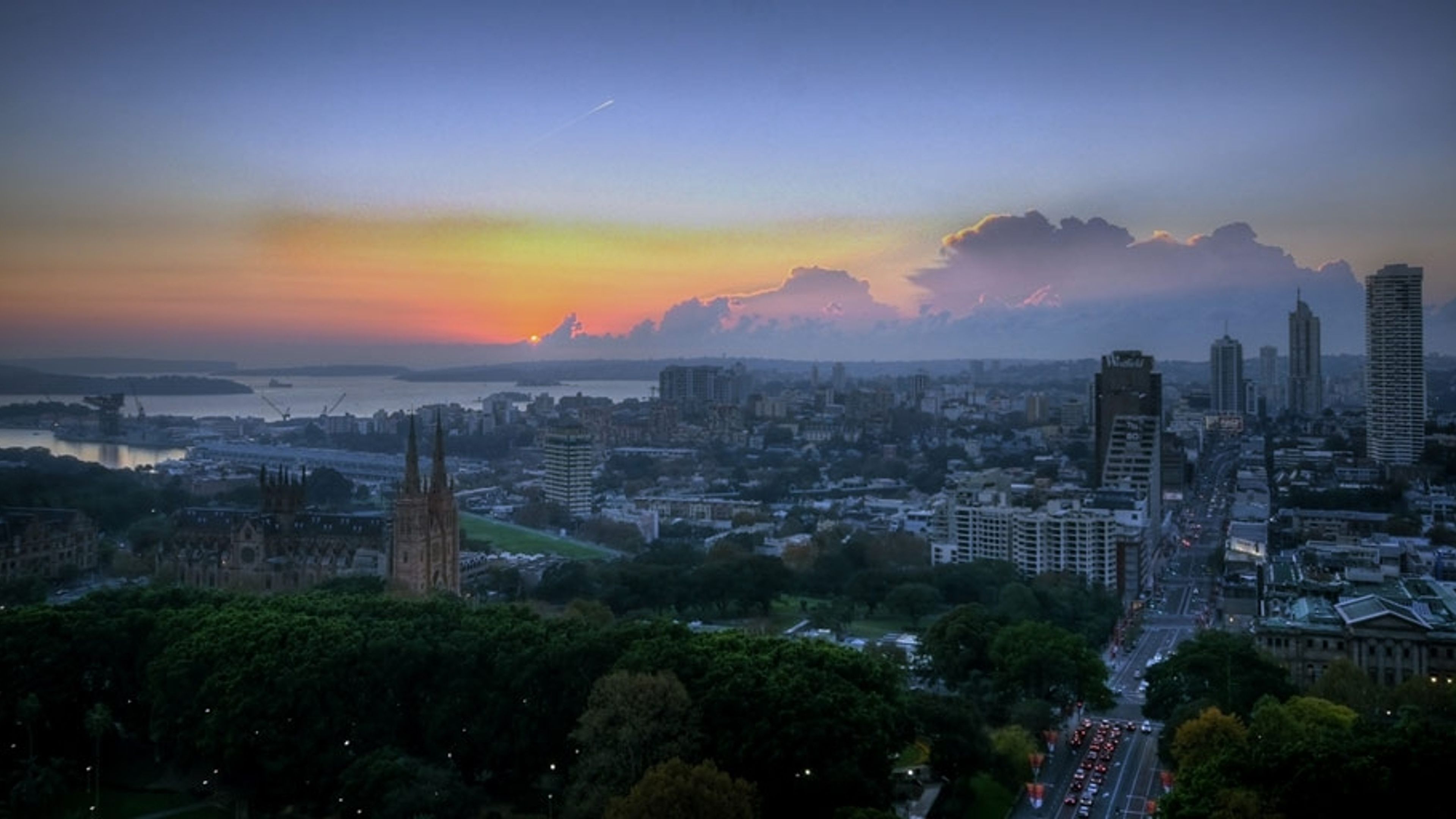 The first rays of sun pouring through a cloud formation over eastern ...