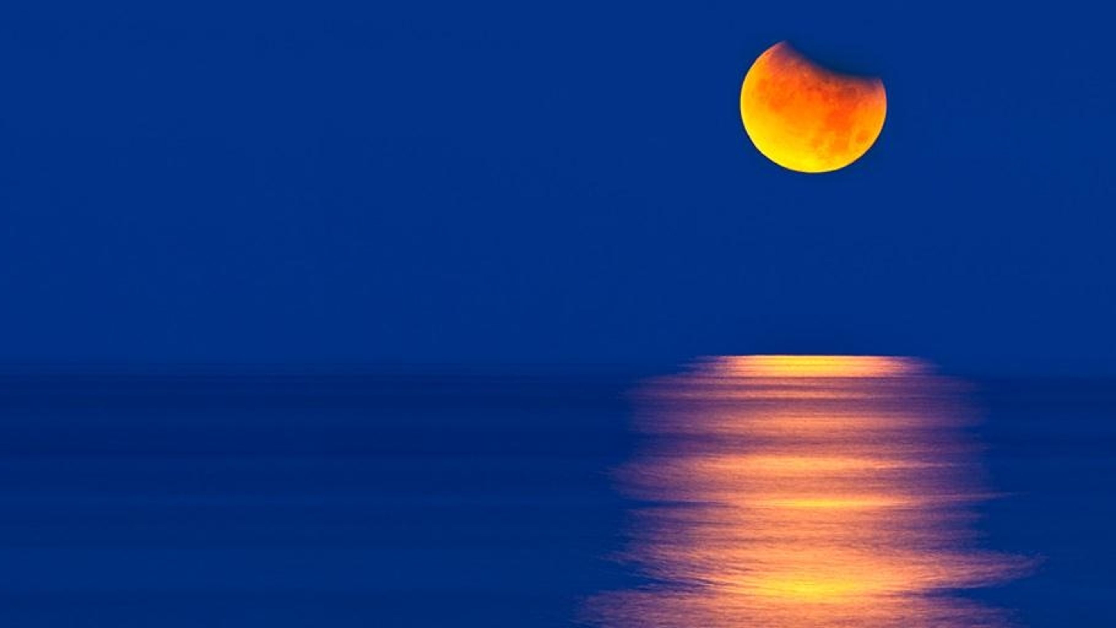 Partial eclipse of the moon setting over the Gulf of Mexico - Bing Gallery