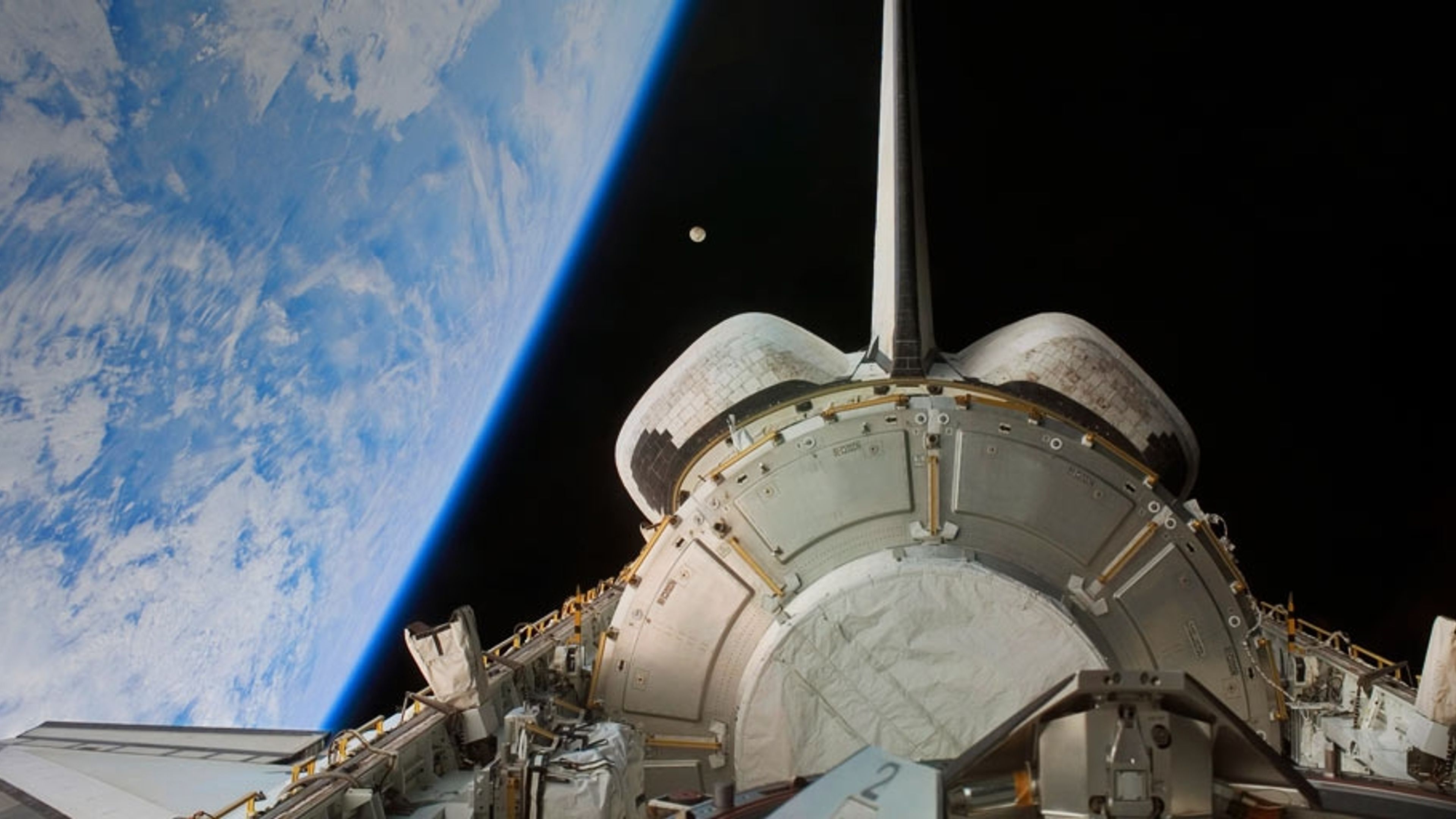 Space Shuttle Discovery backdropped by Earth and the Moon - Bing Gallery