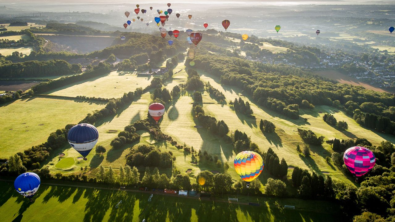 Hot air balloons over a golf course during the Bristol International ...